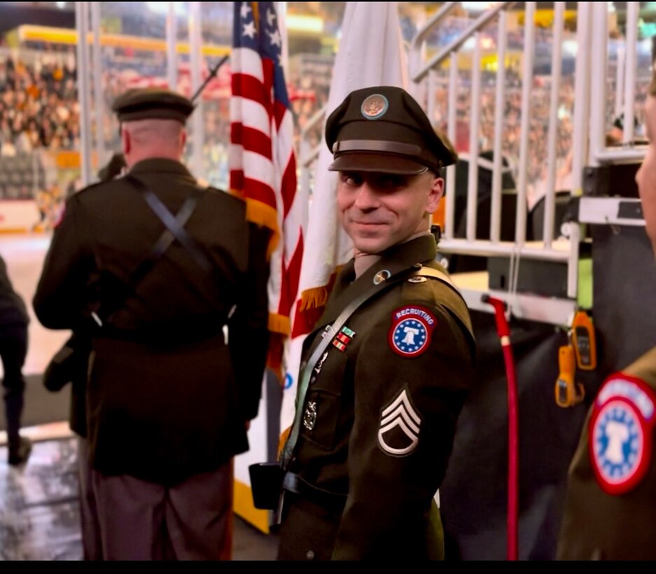 Staff Sgt. Riggleman looks back at camera at PPG Paints Arena Acting U ...
