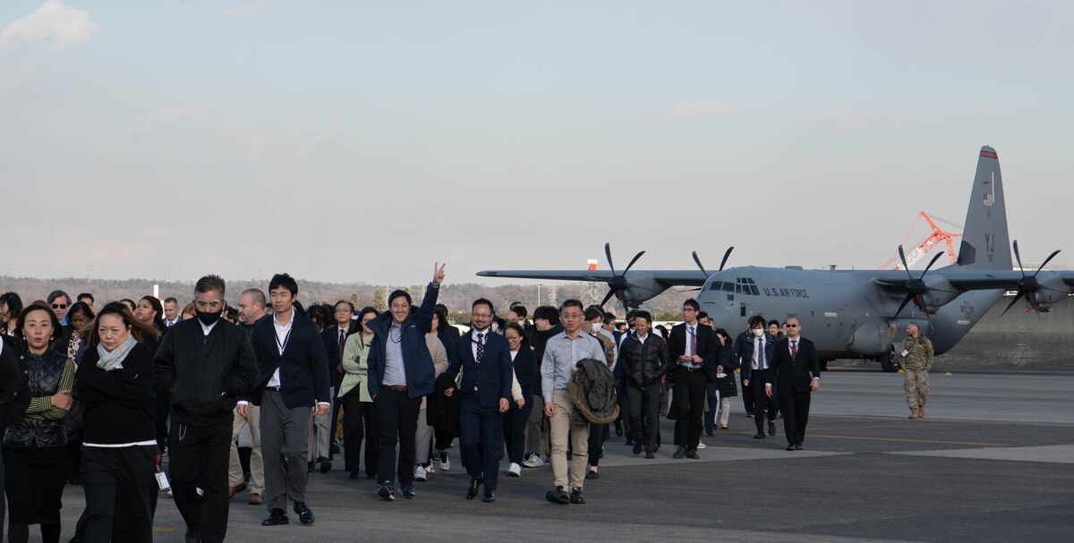 DFAS personnel walk the flightline > Yokota Air Base > Article Display