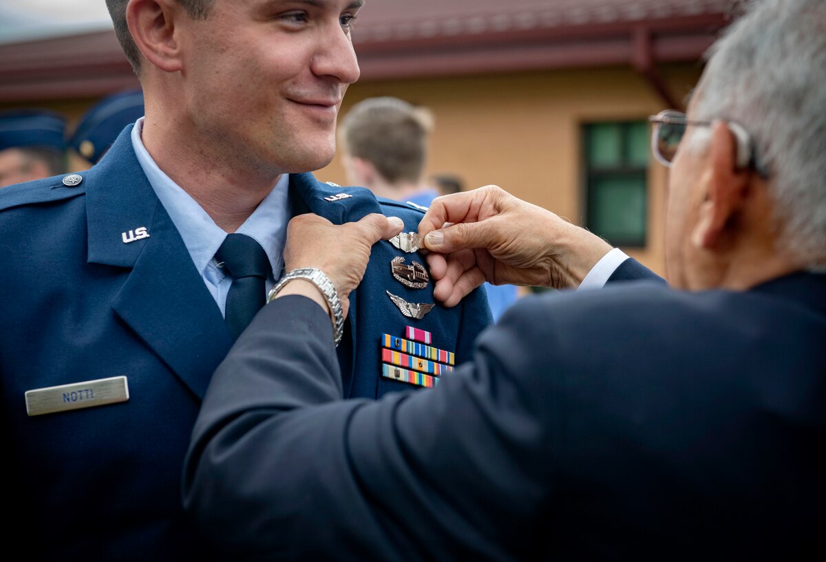 Thirty-six members of UPT Class 25-11 receive their wings during a ...