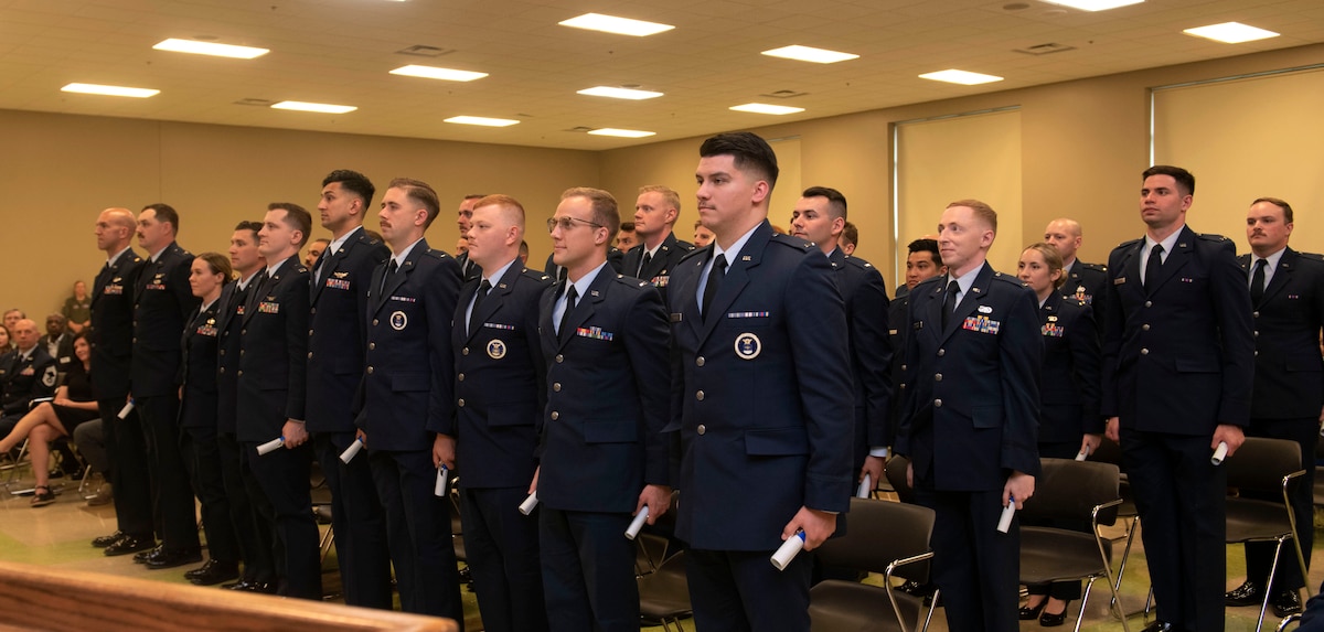 Thirty-six members of UPT Class 25-11 receive their wings during a ...