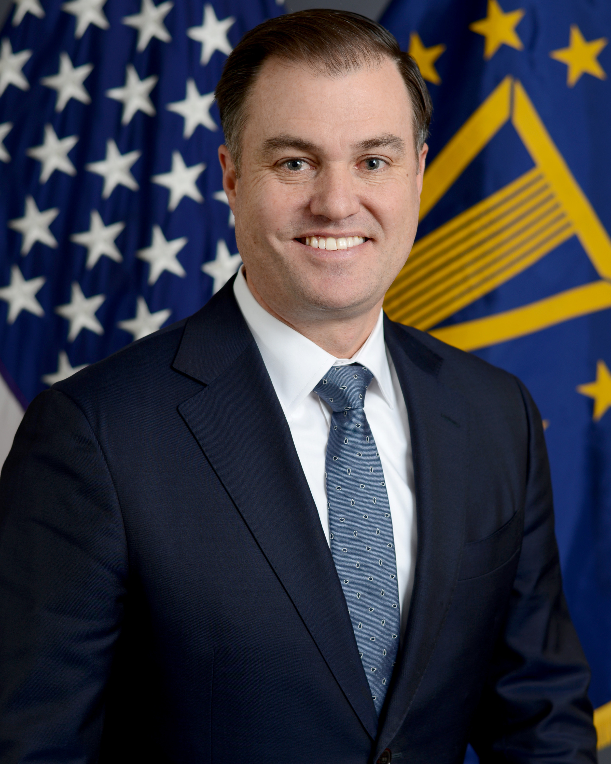 Macon "Dane" Hughes > U.S. Department of War > Biography