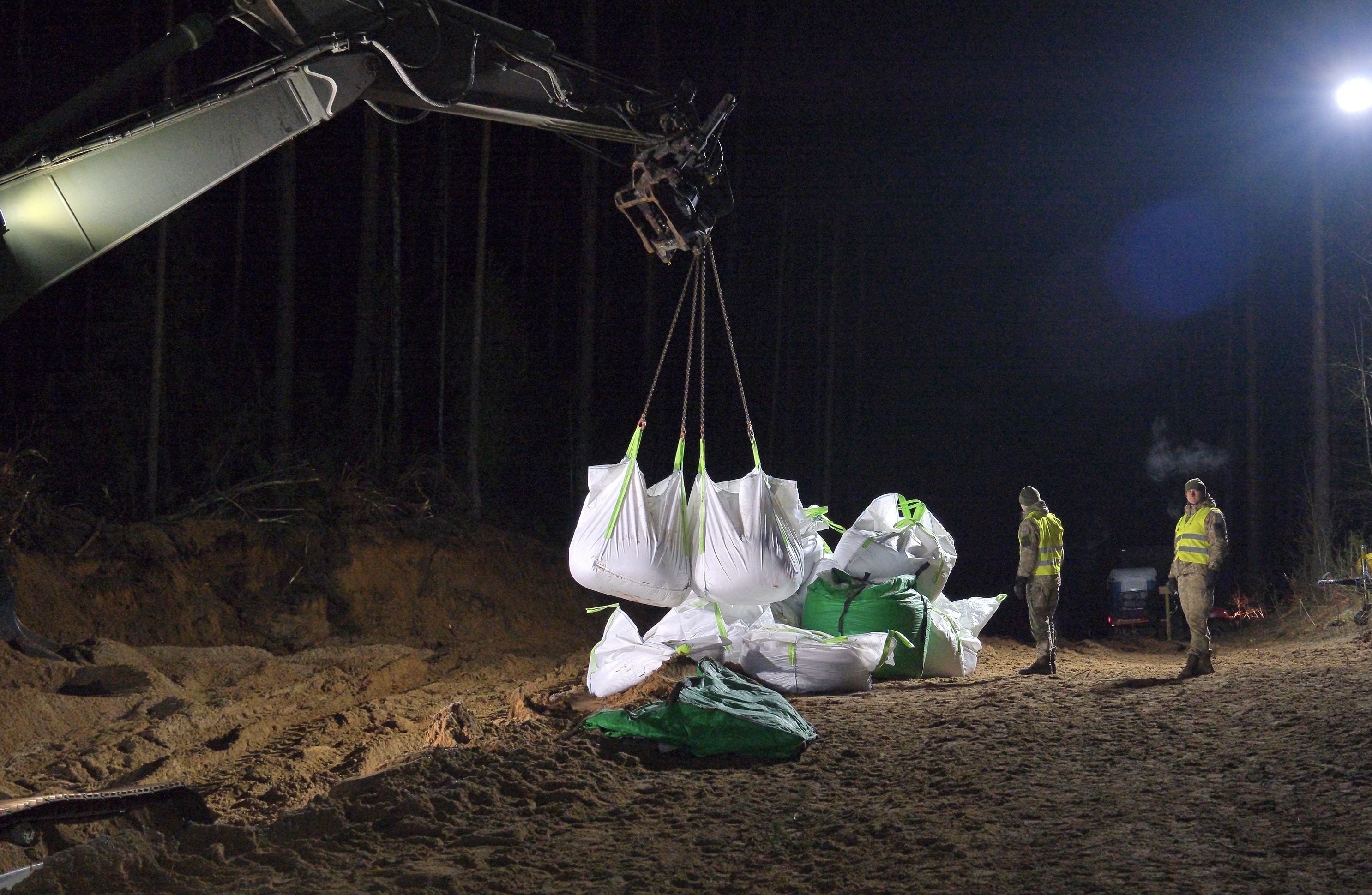 Recovery Efforts Continue at Site of Submerged Vehicle in Search for Missing Soldiers