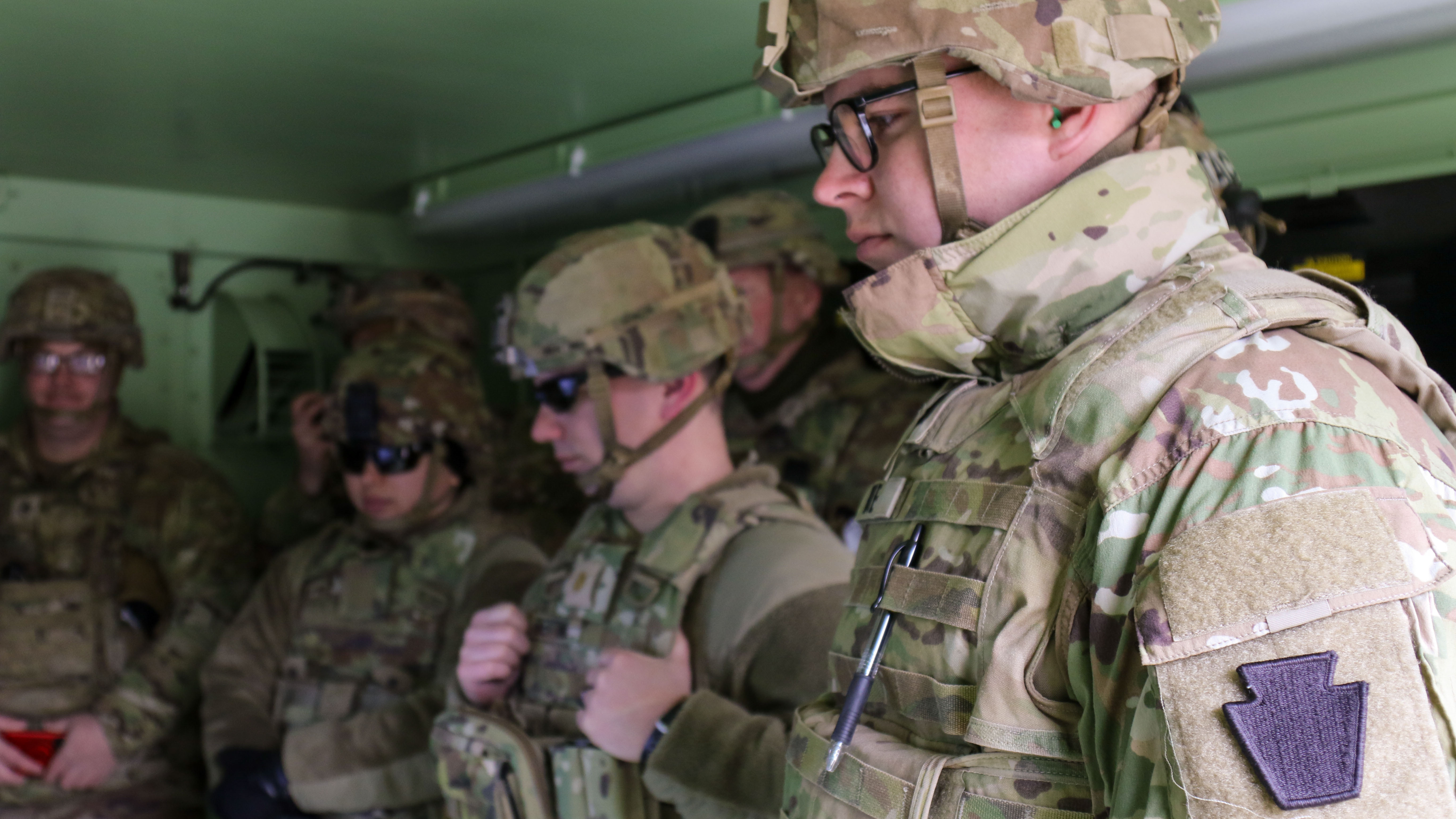 U.S. Soldiers watch a recording of a Project Shiv flight