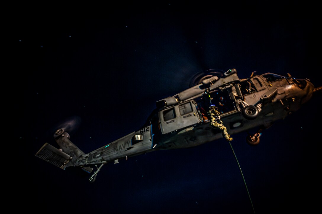 EOD members conduct fast-rope ops onto USS Nimitz in South China Sea