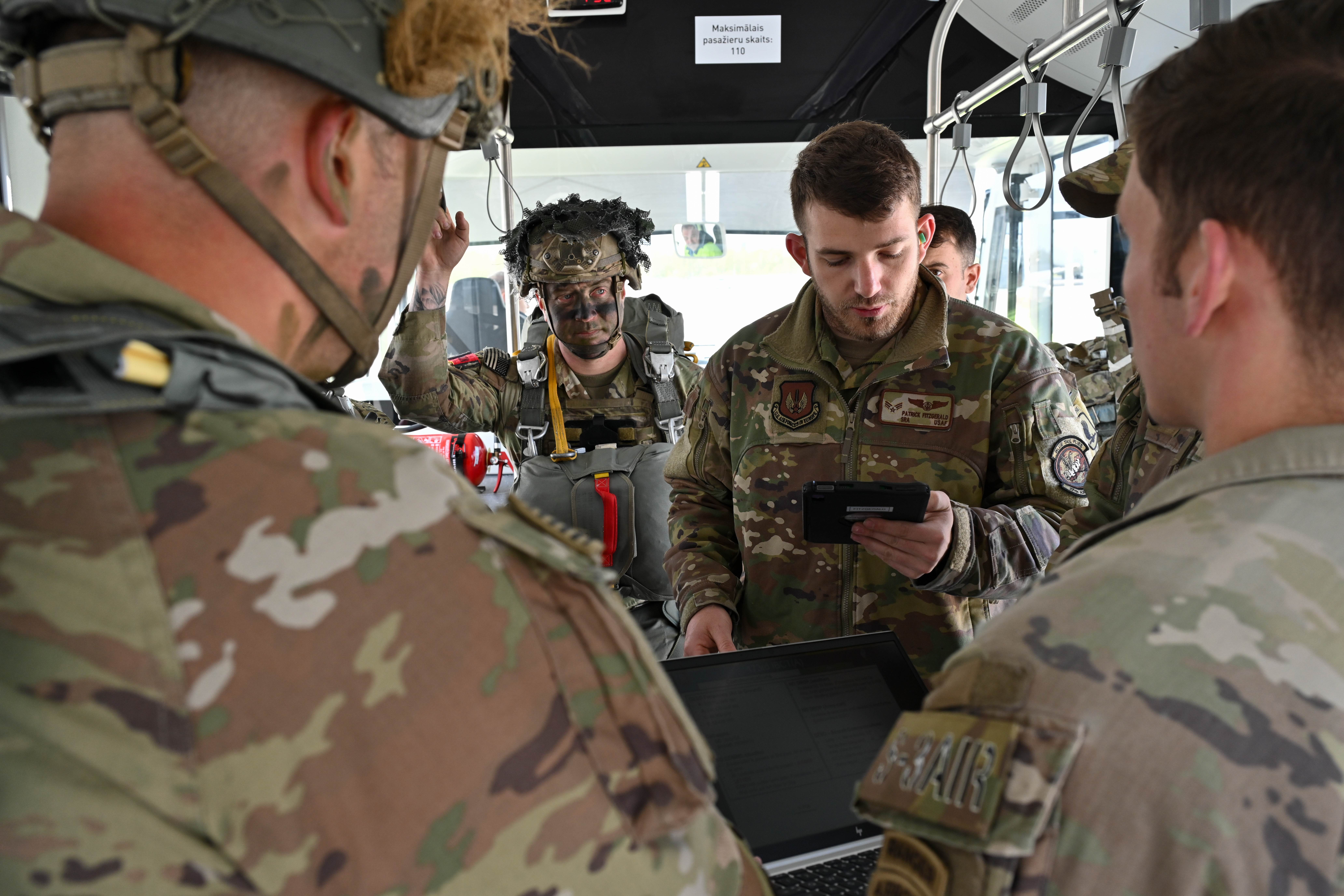 Confirming the flight manifest with a U.S. Airman