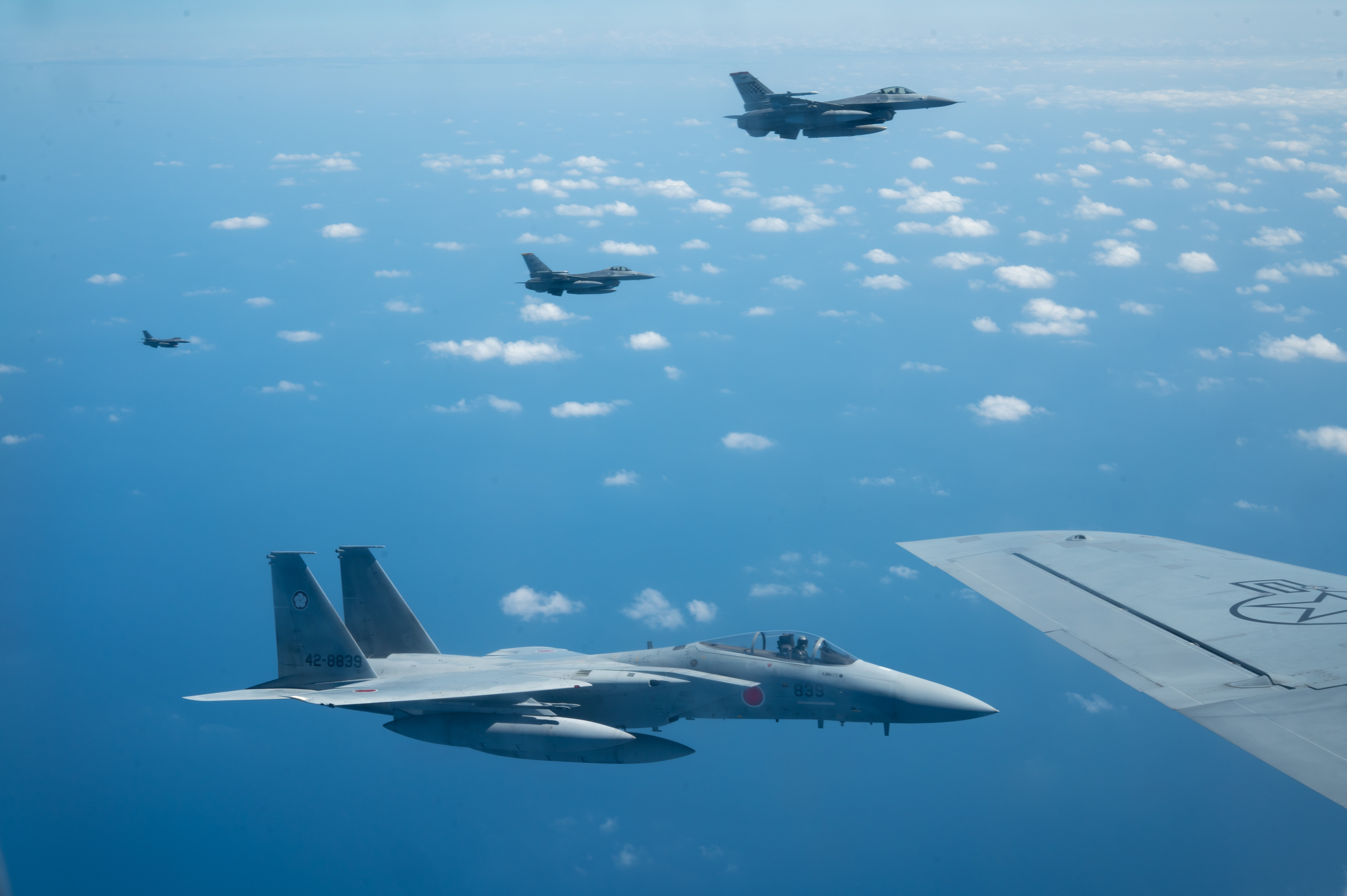JASDF F-15Js and U.S. Air Force F-16 Fighting Falcons Formation ...